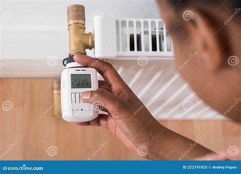 Woman Adjusting Temperature On Thermostat Stock Image Image Of Black Fingers 222741925