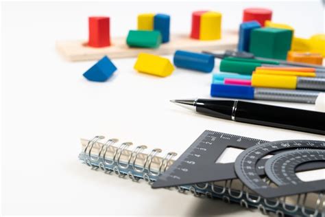 Premium Photo Multi Colored Geometric Shapes And Instruments On White Background