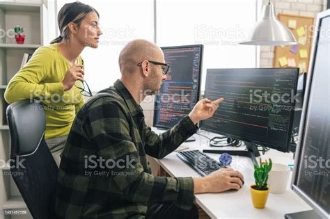 Software Programmers Analyzing Html Code And Database Brainstorming Script Ideas To Develop New