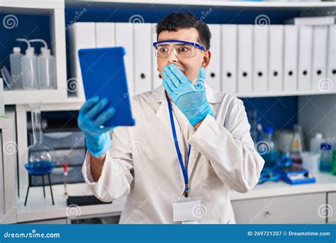 Non Binary Person Working At Scientist Laboratory Using Tablet Covering