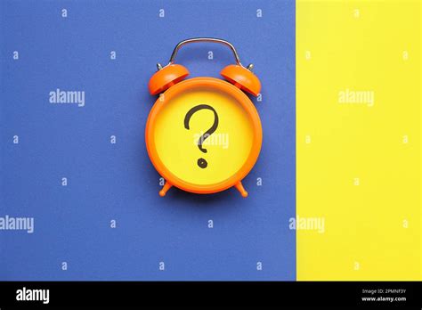 Alarm Clock With Question Mark On Color Background Stock Photo Alamy