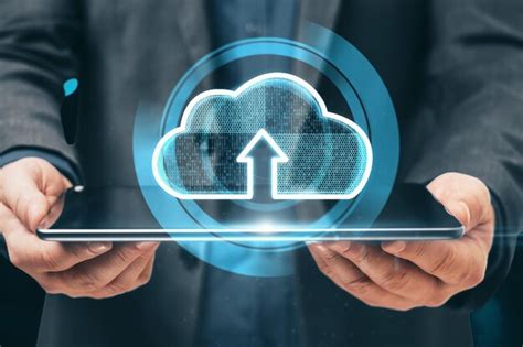 Premium Photo Close Up Of Hand Holding Tablet With Creative Glowing Clouds Hologram On Blurry