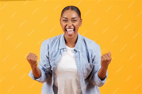 Premium Photo Joyful Emotional Black Woman Cheering And Screaming