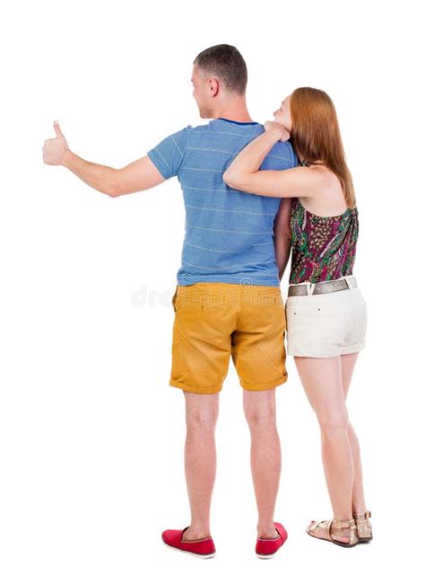 Молодые пары указывая на Wal задний взгляд Стоковое Изображение изображение насчитывающей