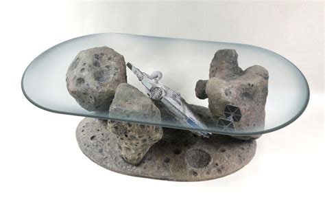 Millennium Falcon Coffee Table Unfolds Asteroid Chase Scene
