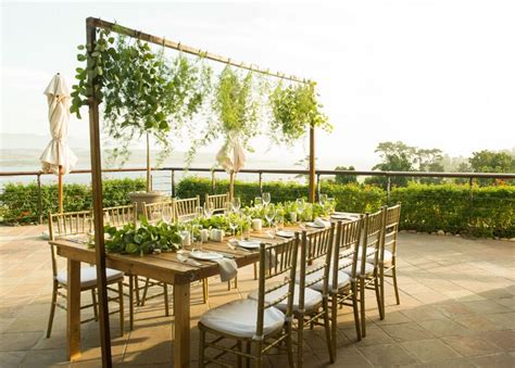 Naked Wooden Table Leafy Runner And Hanging Centrepieces Dinner