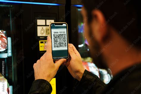Man Scanning Qr Code While Standing In Subway Stock Photo Adobe Stock