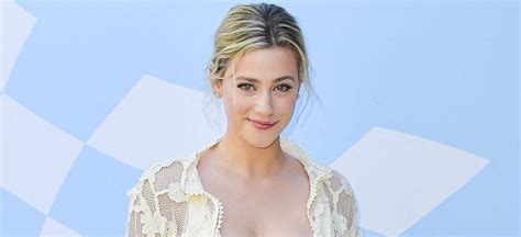 Lili Reinhart Cups Her Chest While Wearing A Tiny White Bikini Top