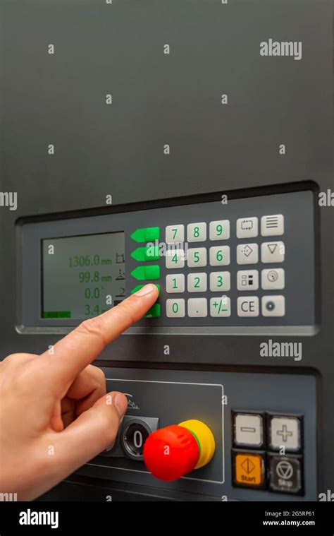 The Process Of Programming A Cnc Machine Entering Data Into A Computer
