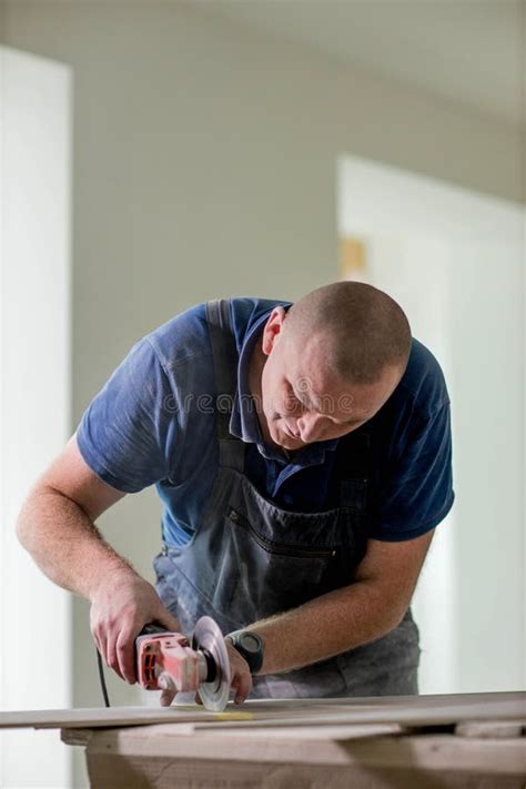 Professional Tiler Cutting Ceramic Tile For The Floor Or Wall Flooring And Tiling Stock Image