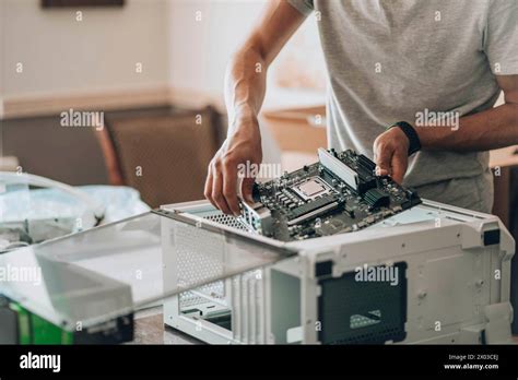 Tech Tactician Meticulously Assembling Components Hands Guide The Central Hub Of Processing