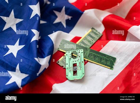 The Flag Of The United States Of America On The CPU Processor Or GPU Chip On The Motherboard