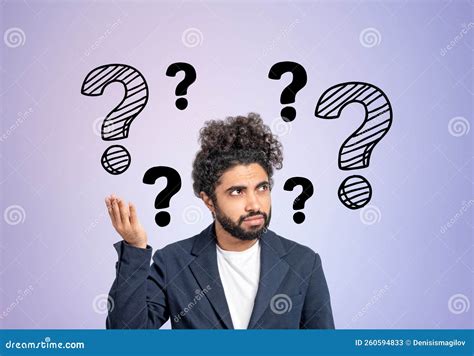 arab businessman portrait with confused look set of question marks