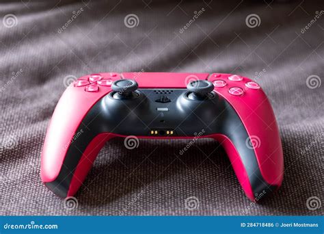 A Close Up Portrait Of A Wireless Cosmic Red Ps5 Playstation 5 Controller Ready To Be Played