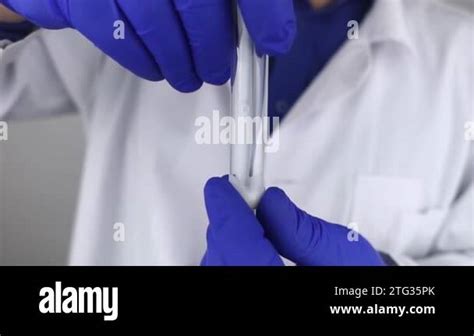 Medical Laboratory Assistant Checks A Test Tube With Sperm Spermogram Male Fertility Test