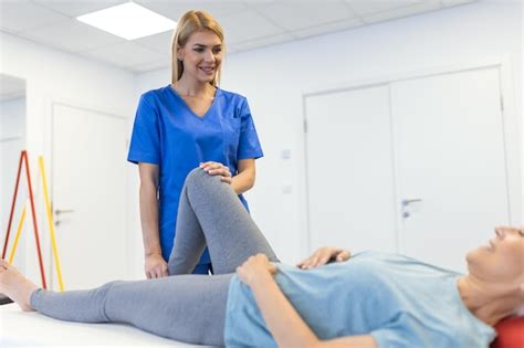 Premium Photo Physiotherapist Working With Patient In Clinic Closeup