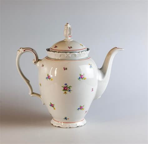 Premium Photo Porcelain Teapot With Floral Ornament In Classic Style On White Background