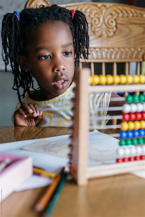 Black Girl Using An Abacus By Stocksy Contributor Gabi Bucataru Stocksy