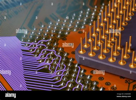 Macro Photo Of Printed Circuit Board With Illuminated Wires Pin Grid Array And Processor With
