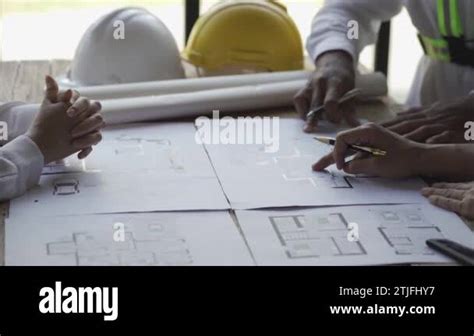 Multi Ethnic Engineers Architects Discuss Construction Plans