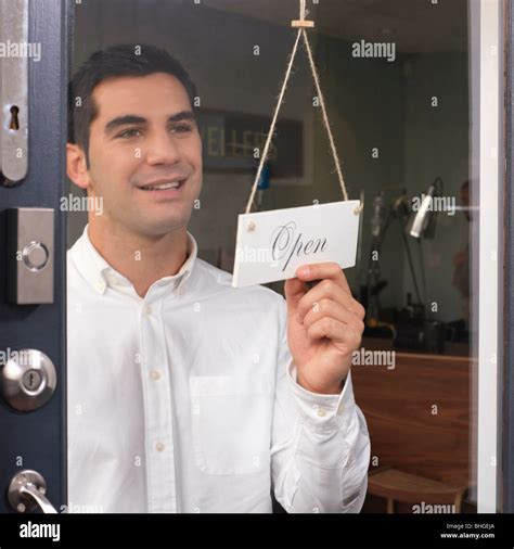 Man At Door Saying Open Stock Photo Alamy