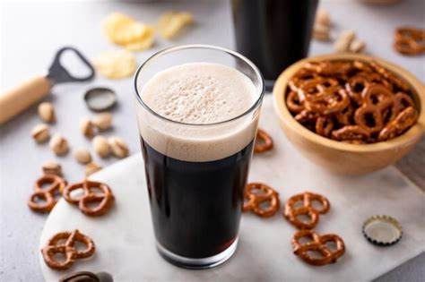 Premium Photo Dark Stout Beer In Tall Glasses On The Table