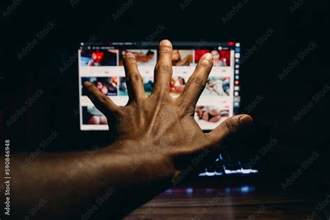 Hands Of A Person Covering The Screen That Contains Pornographic Images Stock Photo Adobe Stock