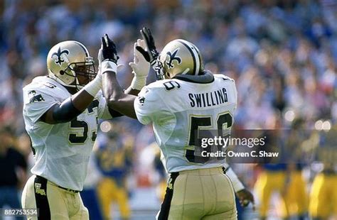 Scott Pelluer And Pat Swilling Of The New Orleans Saints Celebrate