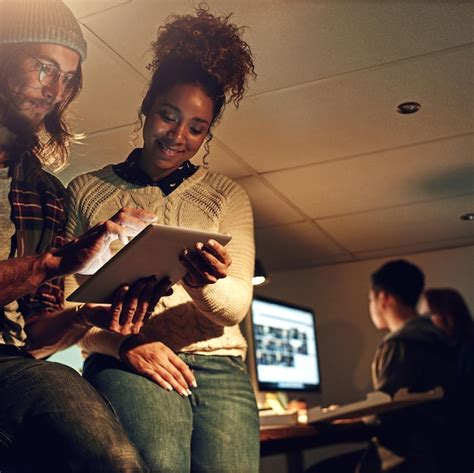 Premium Photo Teamwork Tablet And Communication With People In Office At Night For Planning