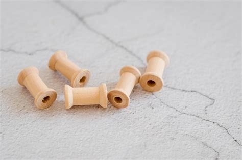 Premium Photo Empty Wooden Thread Spools