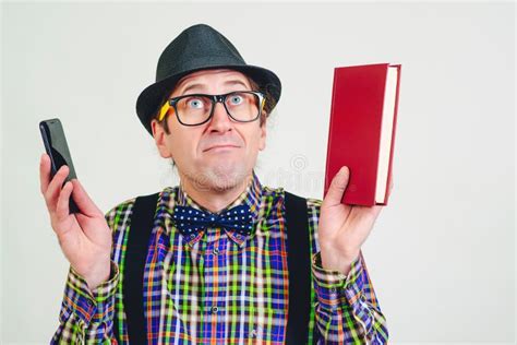 Funny Nerd With Glasses With Book And Mobile Phone Playful Man In Checkered Shirt And Black Hat