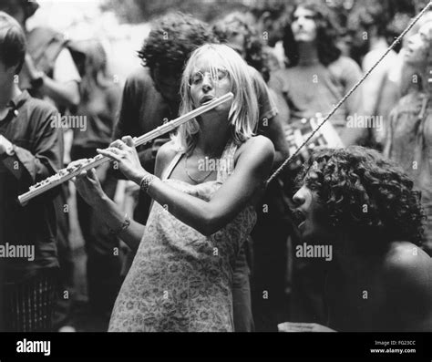 Hippie Movement 1969 Na Woman Plays The Flute With Other Musicians