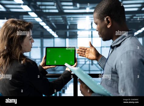 Computer Scientists In Data Center Use Green Screen Tablet To Calibrate Energy Usage Team Of