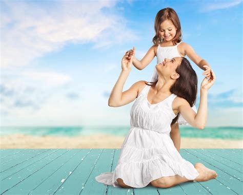 Premium Photo Young Mother And Her Cute Little Daughter