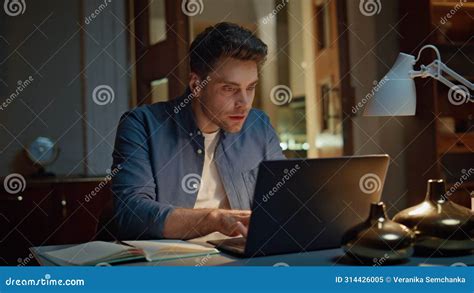 Focused Man Staring Computer Reading Email At Dark Flat Closeup Excited Winner Stock Image