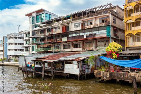 Cityscape With Collapsing Wooden Residential Slums On Stilts Against The Backdrop Of Old And