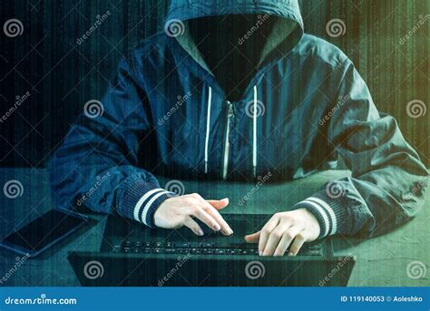 Anonymous Hacker Uses A Laptop To Hack The System Stealing Personal Data And Infection Of