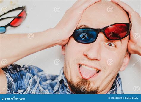 Portrait Of A Funny Young Man Wearing 3d Glasses On A White Background