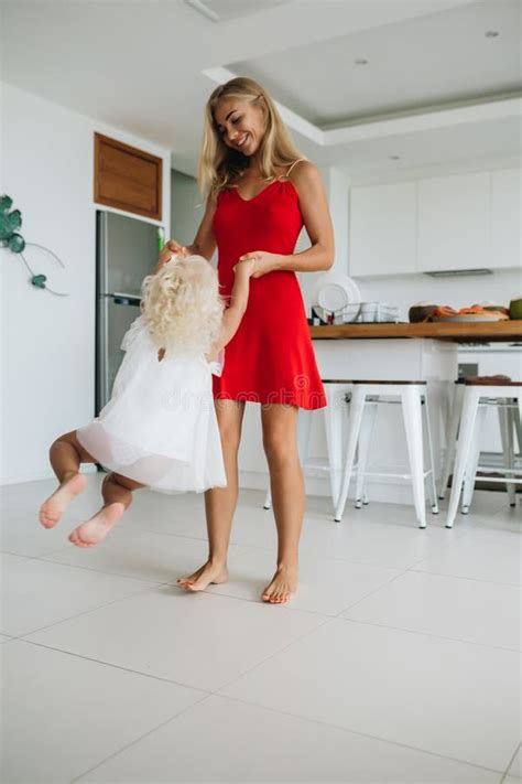 Happy Mother And Daughter Having Fun Dancing At Home Stock Image