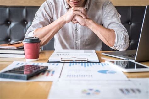 Businessman Analyzing Graphs And Charts Photos By Canva