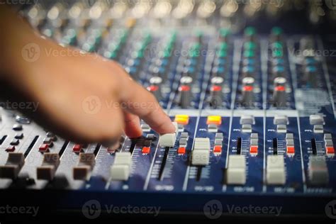 Mens Hands Are Controlling The Console Of A Large Hi Fi System With Flair Light 11505729 Stock