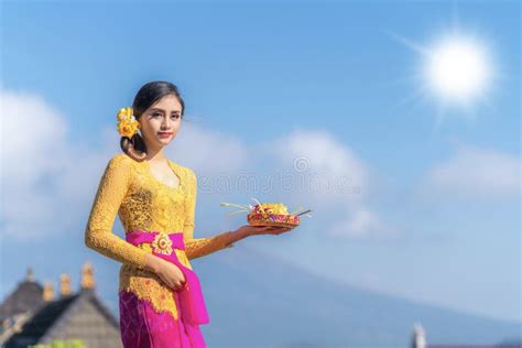 Indonesian Girl With Traditional Costumn Dance In Bali Temple Stock