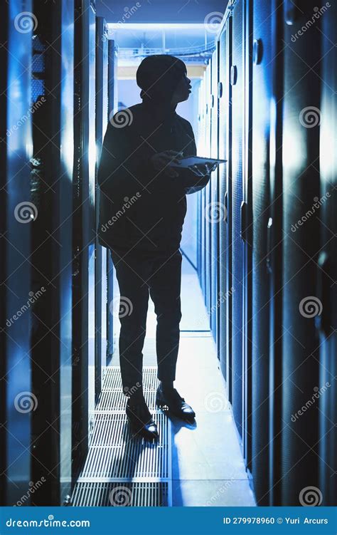 Im About To Pull Of The Heist Of The Century A Hacker Using A Digital Tablet In A Server Room