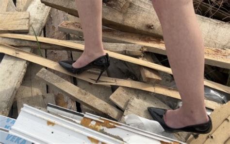 Girl Walks In High Heeled Boots In Deep Snow The Heels Get Stuck She