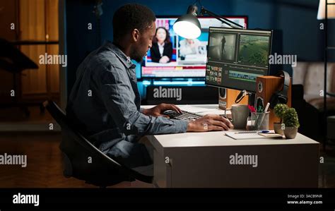 Young Filmmaker Working On Media Post Production From Agency Office Ensuring Editing Timeline