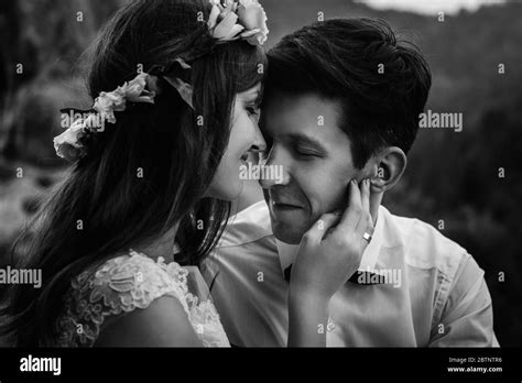 Happy Luxury Couple Of Newlyweds Hugging With Tender On The Top Of A