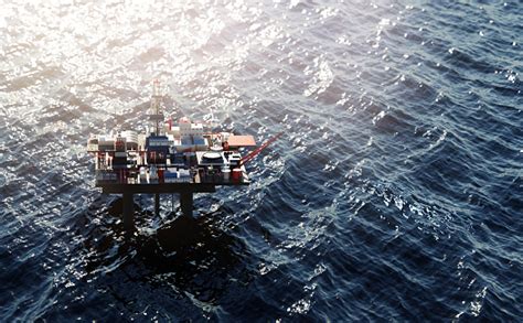 해상 석유 굴착 장치 시추 장비 잭 업 리그 일몰 동안 바다에서의 석유 플랫폼 및 네온 성장 하이트 차트는 가격 역학 변화를 밀어 넣습니다 3d 렌더링 그림 가솔린에 대한