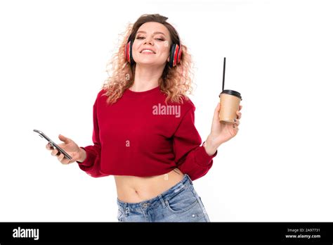 Caucasian Girl With Curly Fair Hair Drinks Coffe And Communicate With