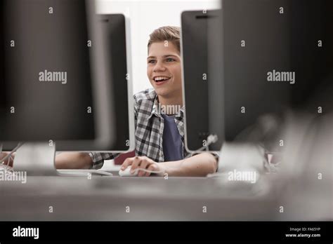 A School Room Computer Laboratory Or Lab With Rows Of Computer Monitors And Seating Young
