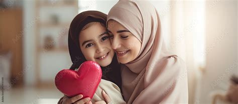 Muslim Girl Embraces Mom With Hijab Greeting With Card And Love Bonding